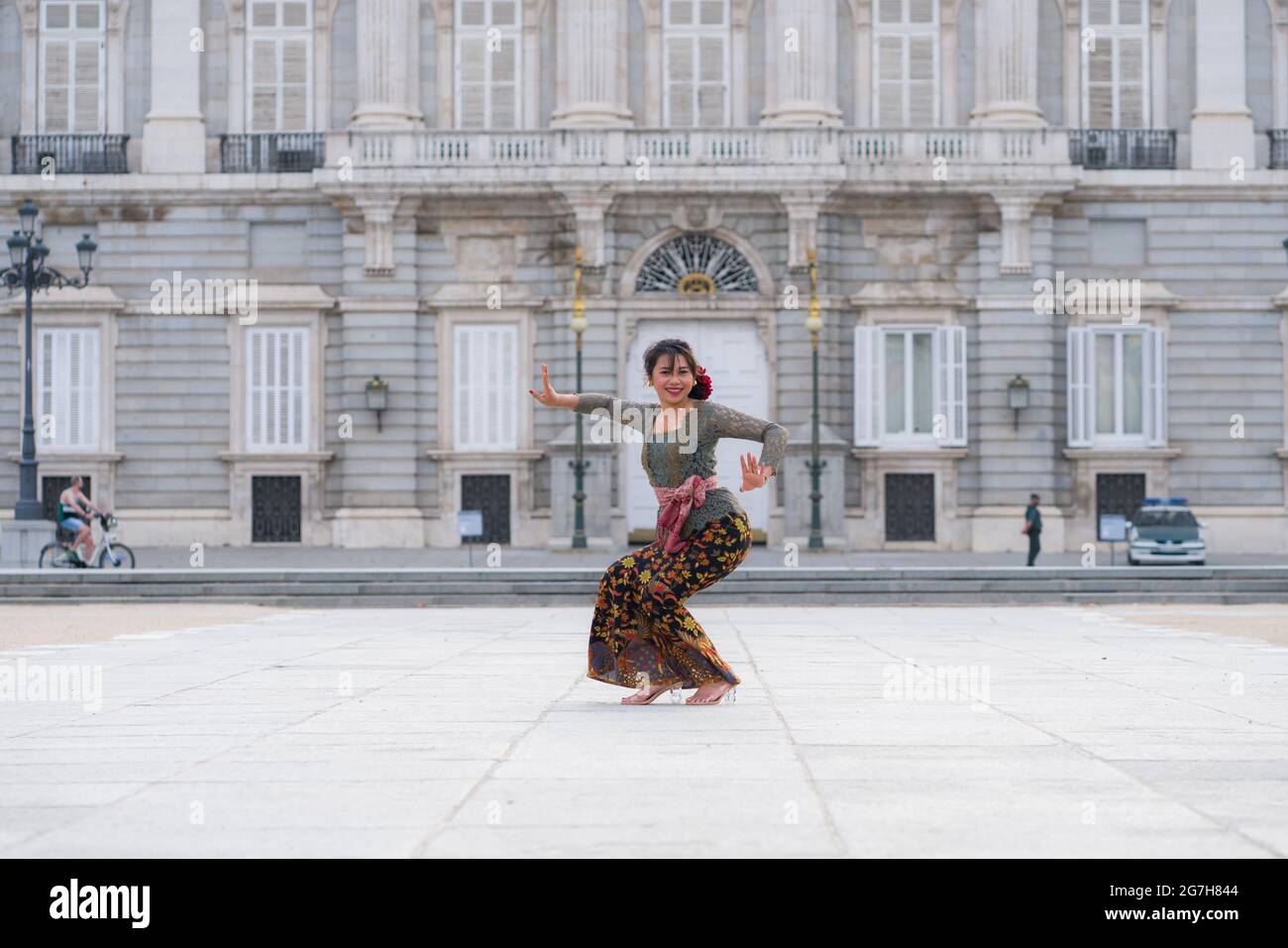young happy Indonesian woman from Bali having vacation in Europe ...