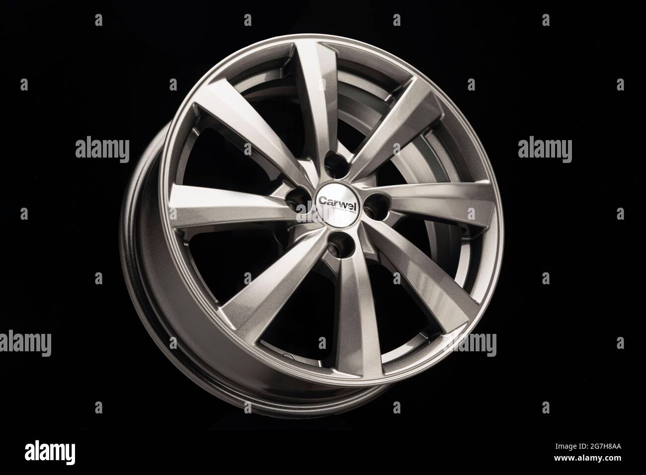 grey alloy wheel, modern auto parts. black background Stock Photo - Alamy