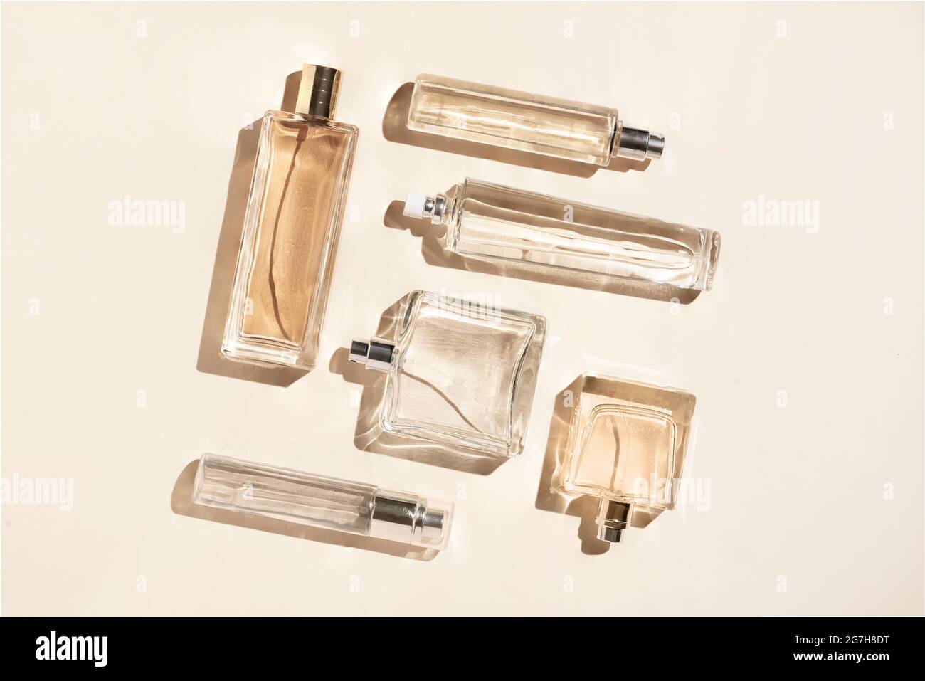 perfume bottles of beige color. Flatlay still life in the style of ...