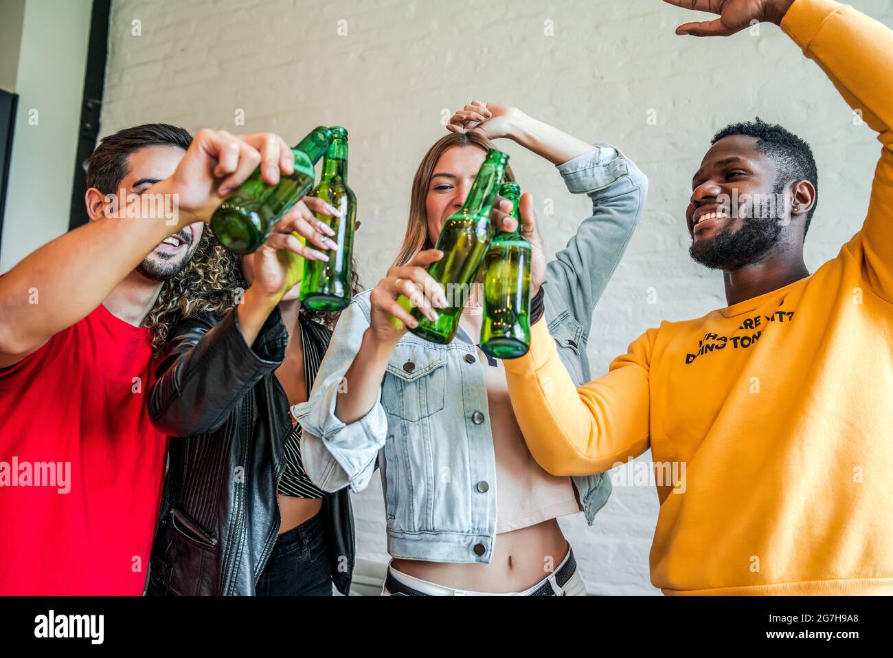 Male friends having beer together hi-res stock photography and images ...