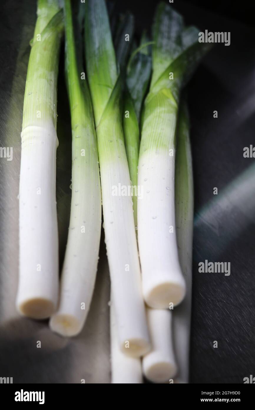 fresh leeks cleaned and ready to be used in the kitchen Stock Photo - Alamy