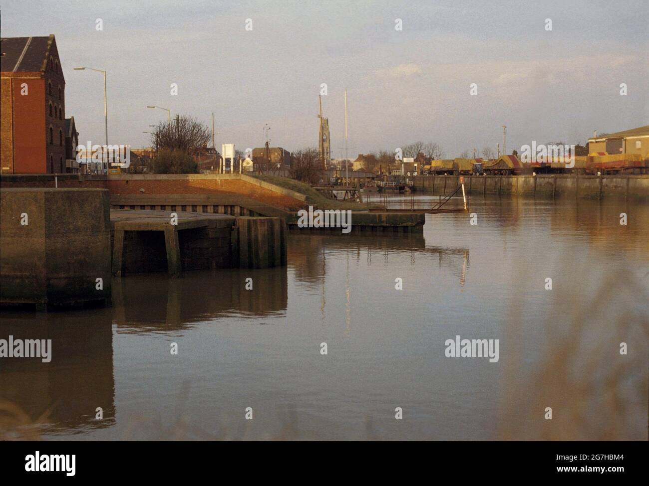 View of the River Haven docks in the late afternoon sun. Vintage film ...