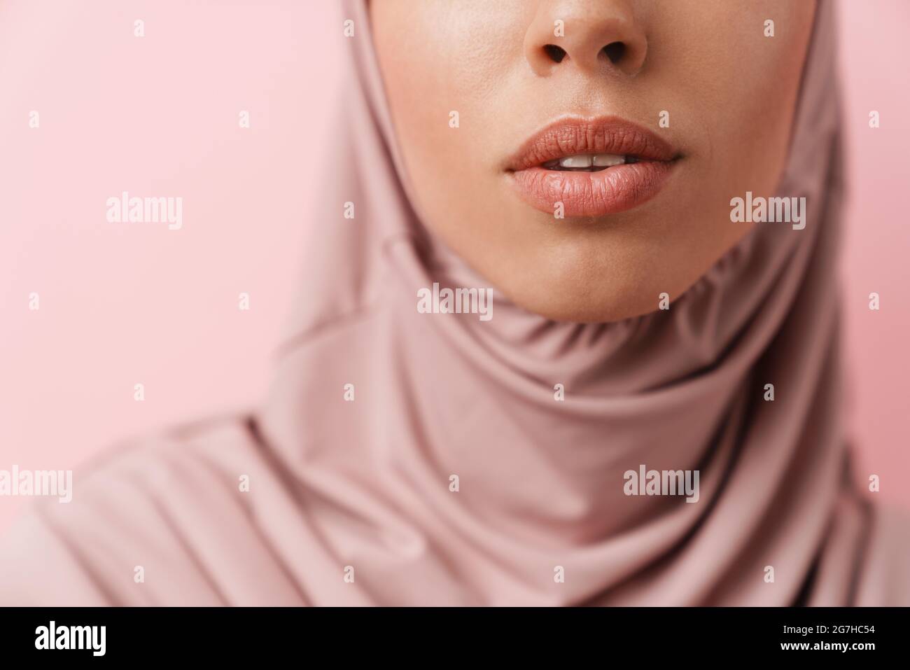 A close-up shot of the lips of a muslim woman wearing a hijab in the ...