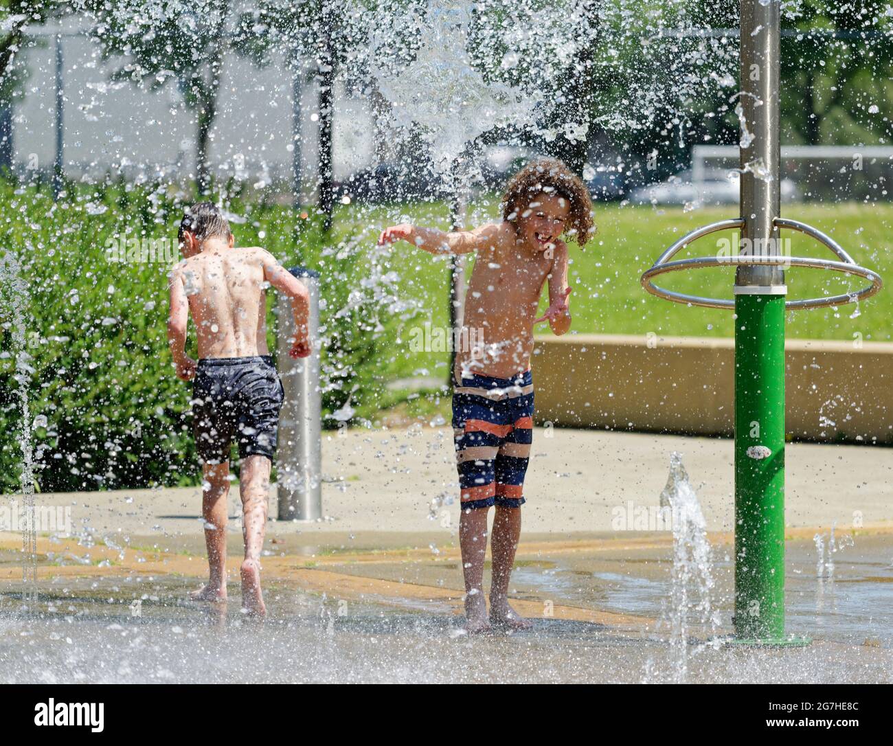 Two boys playing in the park hi-res stock photography and images - Alamy