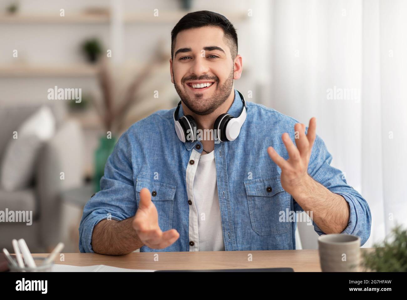 Positive friendly jewish man looking at camera and talking, internet ...