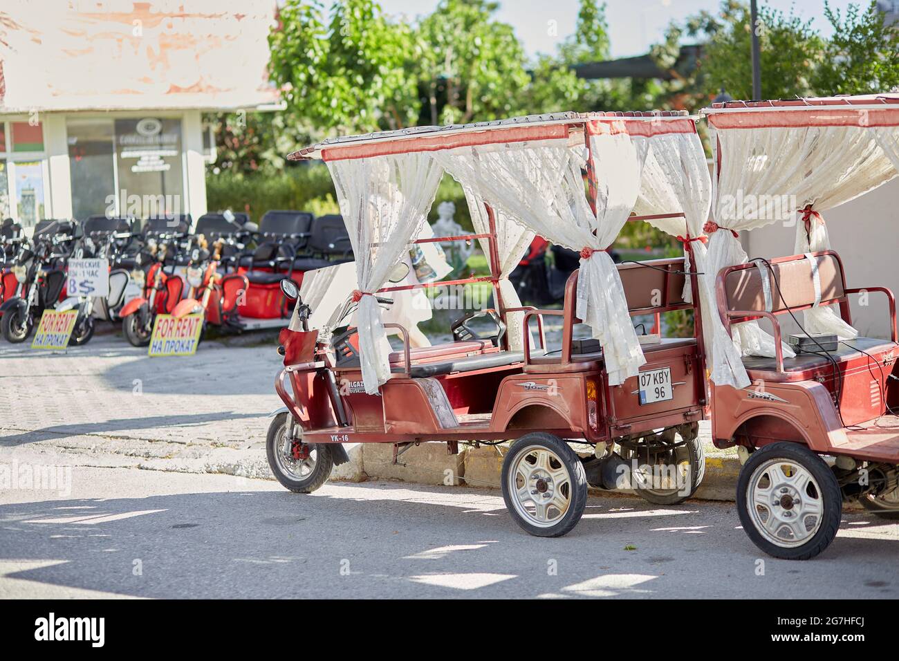 Modern decorated rickshaw on the road. Travel concept. High quality ...