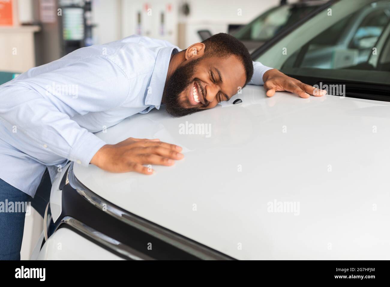 Happy African American Man Hugging Hood Of His New Car, Joyful Smiling ...