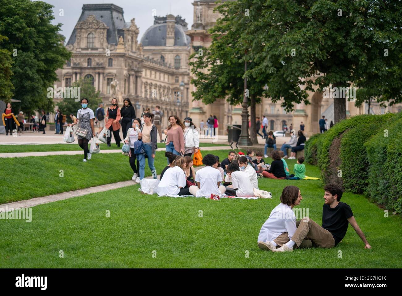 Random People At The Gardens Of The Louvre Or The Louvre Museum Is The Worlds Largest Art