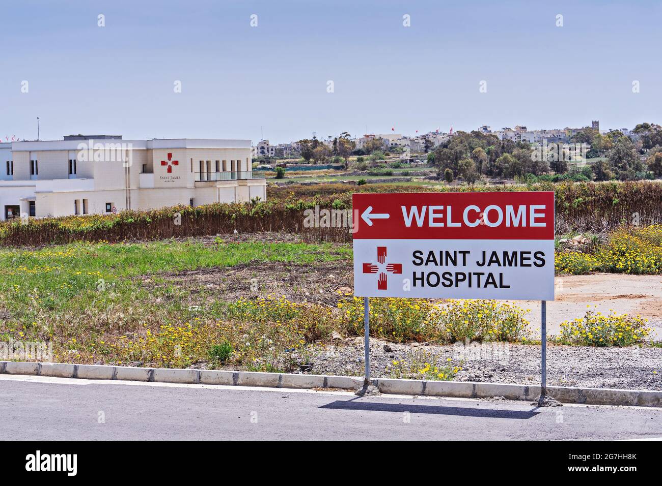 Road signboard with inscription SAINT JAMES HOSPITAL on background of ...