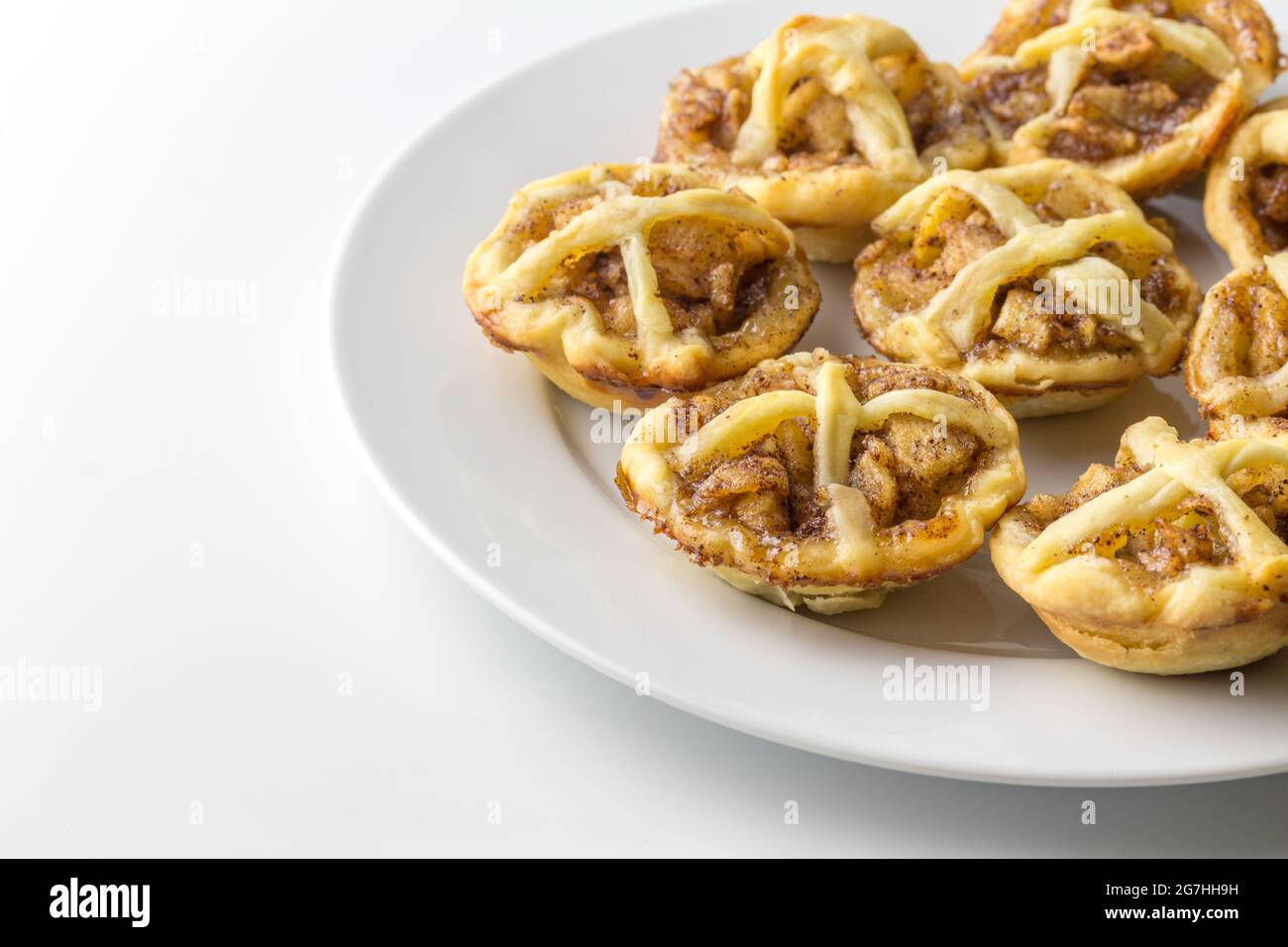Apple pies on plate - mini apple tartlets isolated on white background ...