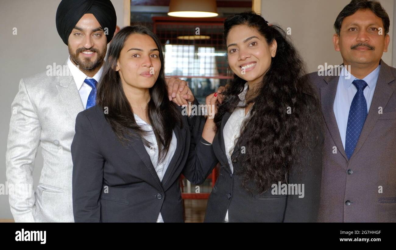 Group of Indian co-workers wearing suits in office Stock Photo - Alamy