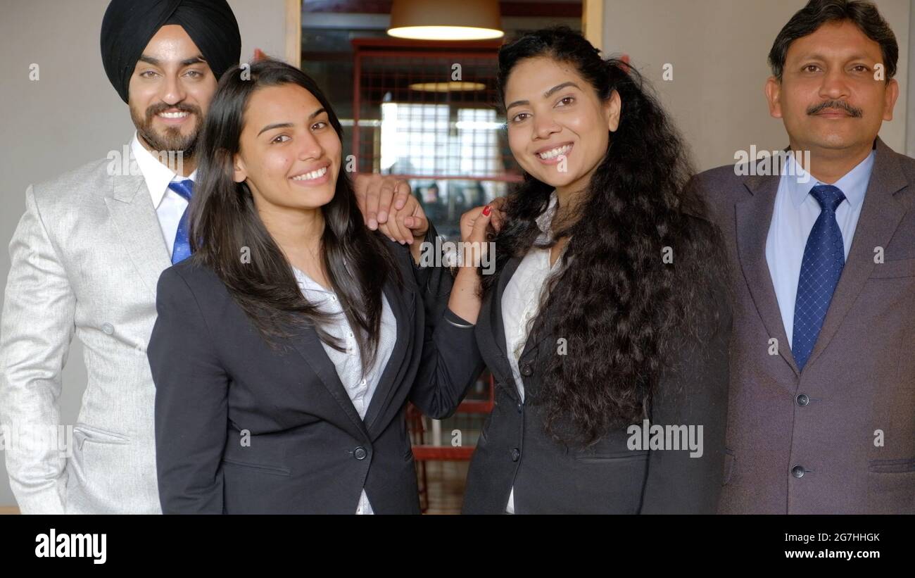 Group of Indian co-workers wearing suits in office Stock Photo - Alamy