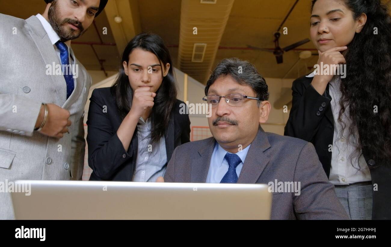 Group of Indian co-workers during a business meeting Stock Photo - Alamy