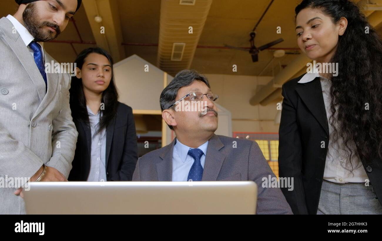 Group of Indian co-workers during a business meeting Stock Photo - Alamy