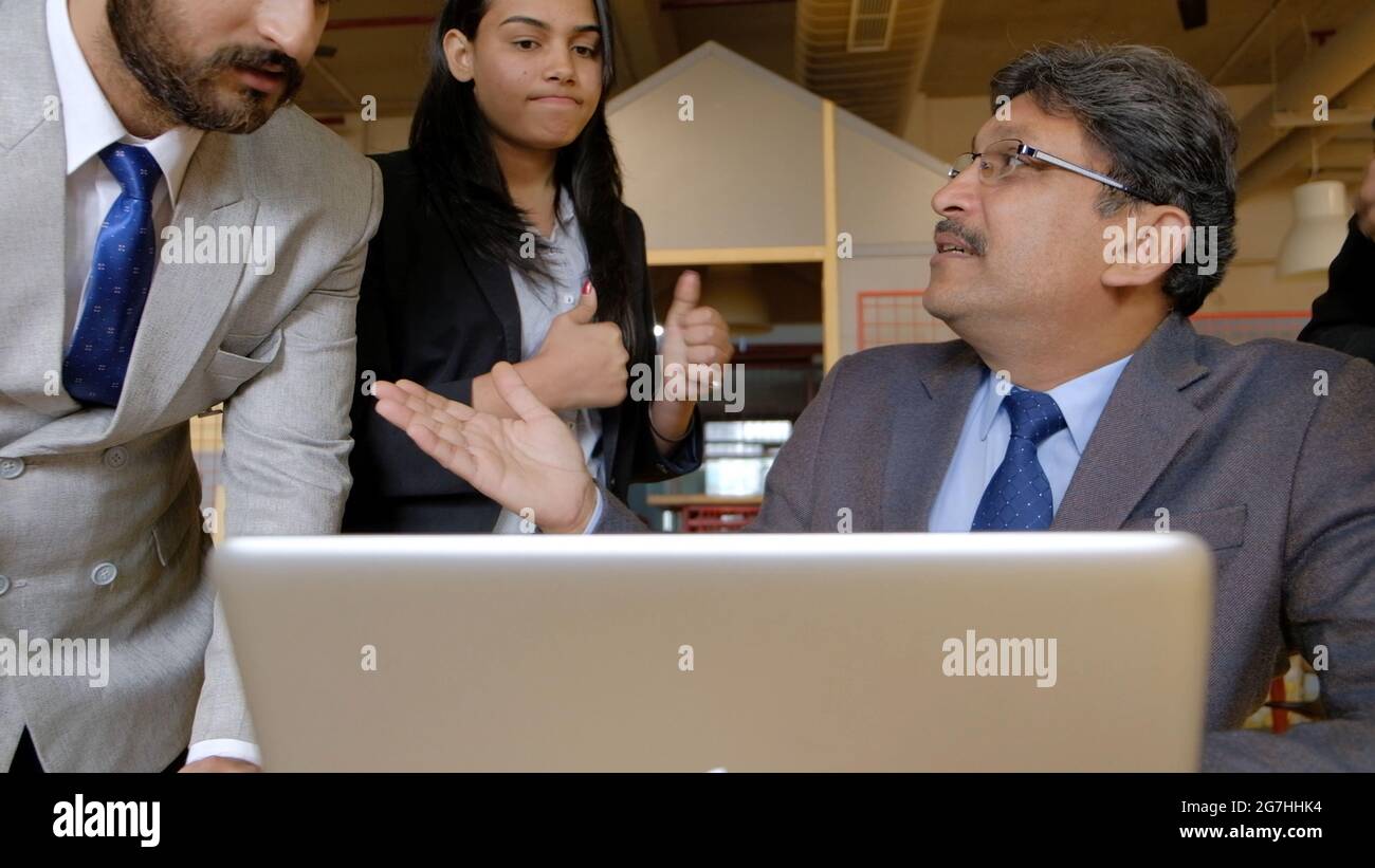Group of Indian co-workers during a business meeting Stock Photo - Alamy