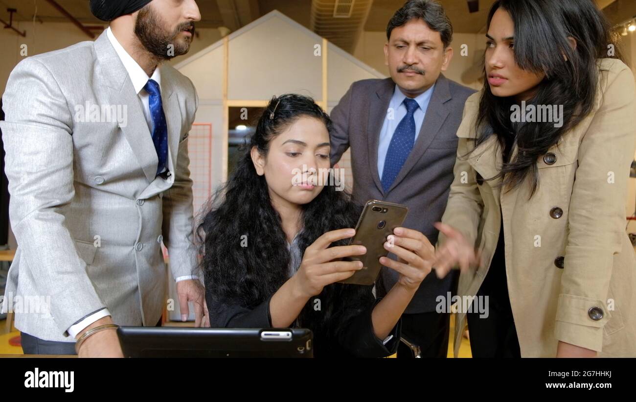 Group of Indian co-workers during a business meeting Stock Photo - Alamy