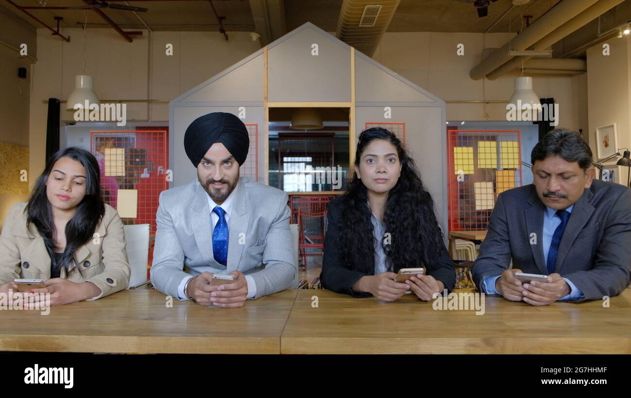 Group of Indian co-workers during a business meeting Stock Photo - Alamy