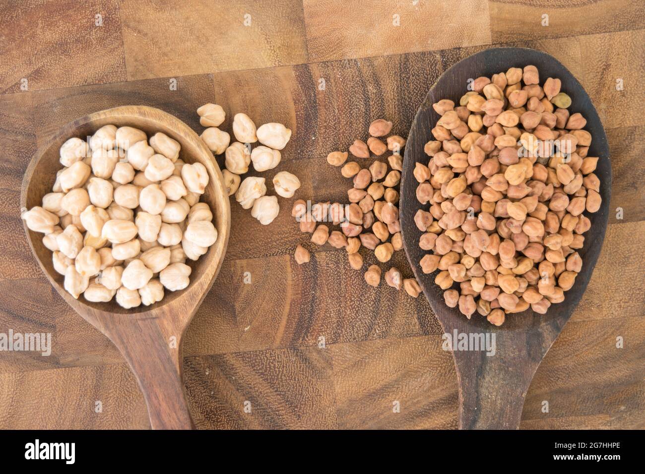 Wooden spoons of raw dal seeds Stock Photo - Alamy