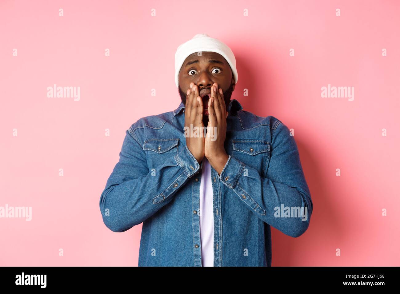 Alarmed and worried Black man staring at bad accident, gasping and ...