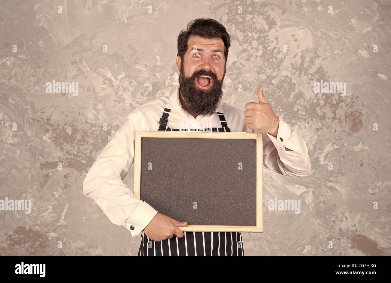 Man good looking hospitable restaurant waiter with blackboard copy ...