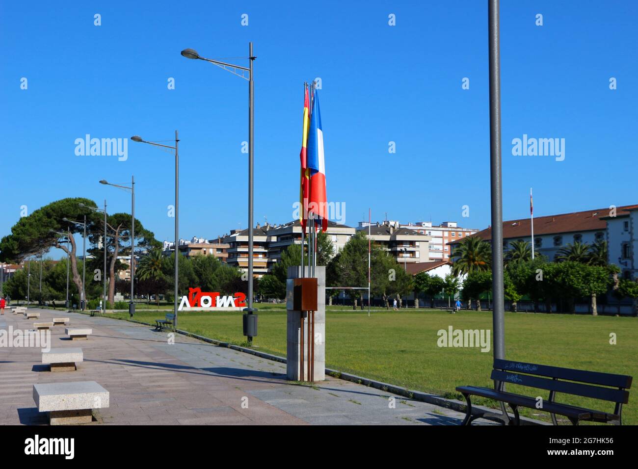 Three flags of Spain France and Great Britain on a bicentenary monument ...