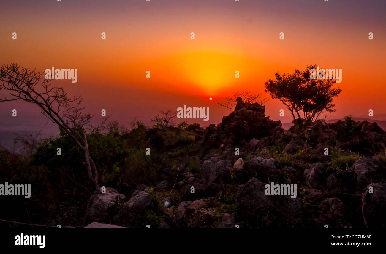 Sun set in the hills Stock Photo - Alamy