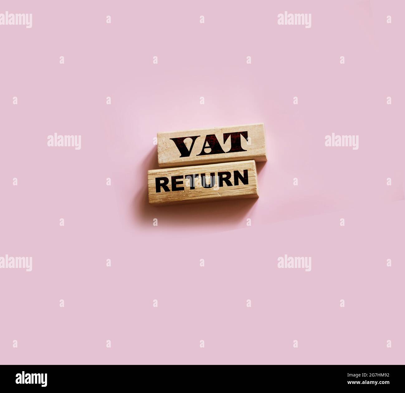 VAT return text Value Added Tax return on wooden blocks. Financial ...