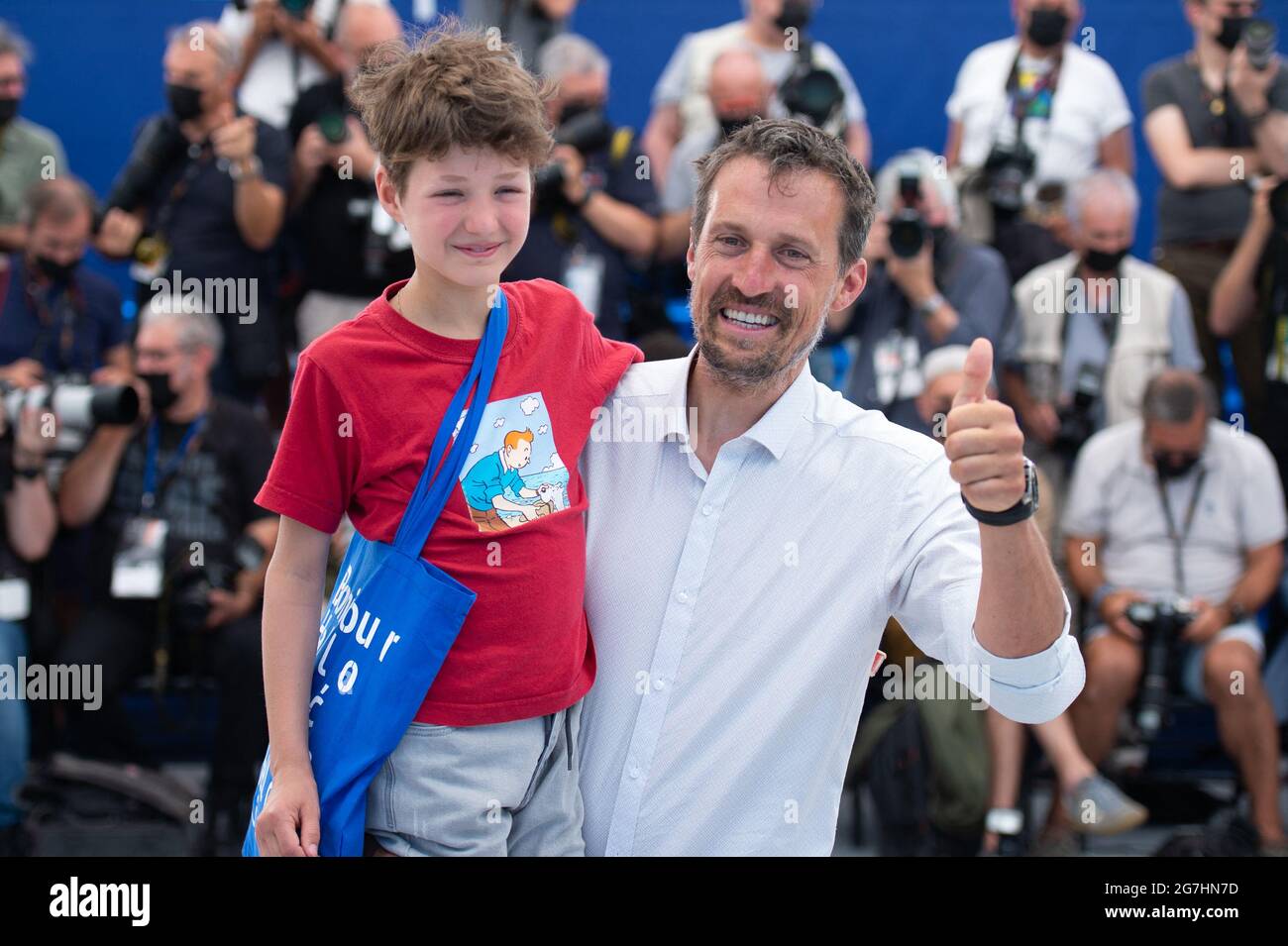 Vincent Munier and his son Simon attending the La Panthere Des Neiges ...