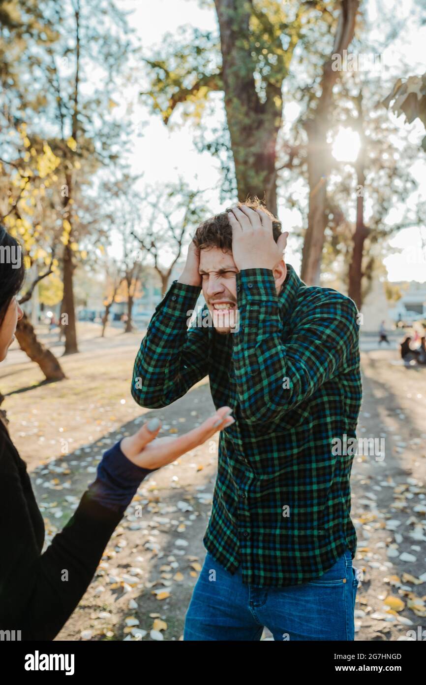 a young couple arguing outdoors Stock Photo - Alamy