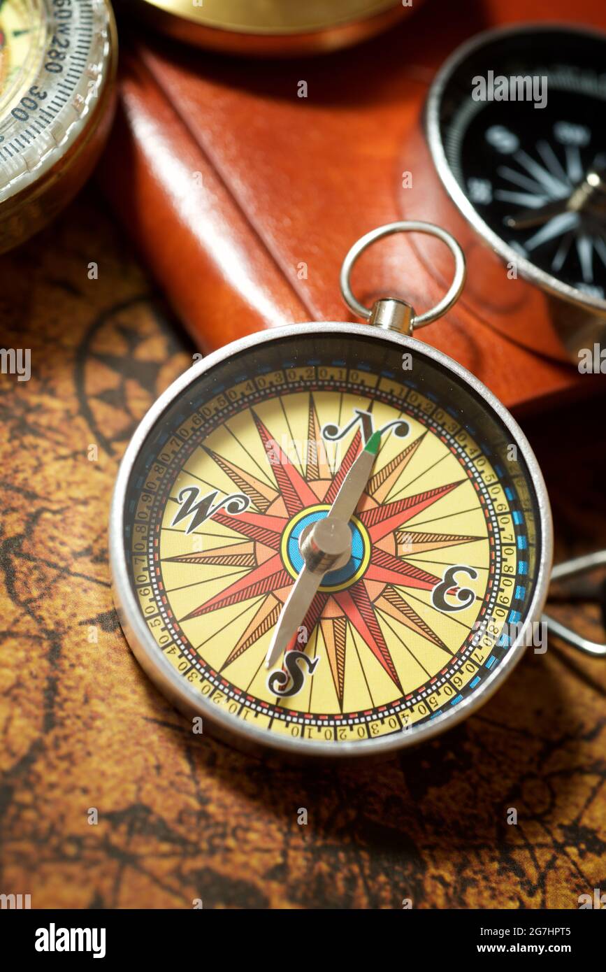 Vintage compass and old navigation map Stock Photo - Alamy