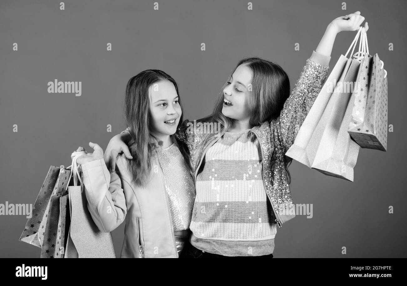 Kid fashion. Happy children. shop assistant with package. Sisterhood ...