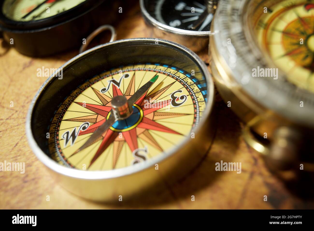 Vintage compass and old navigation map Stock Photo - Alamy