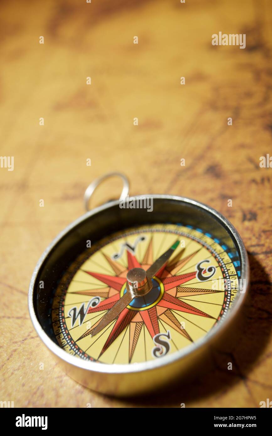 Vintage compass and old navigation map Stock Photo - Alamy