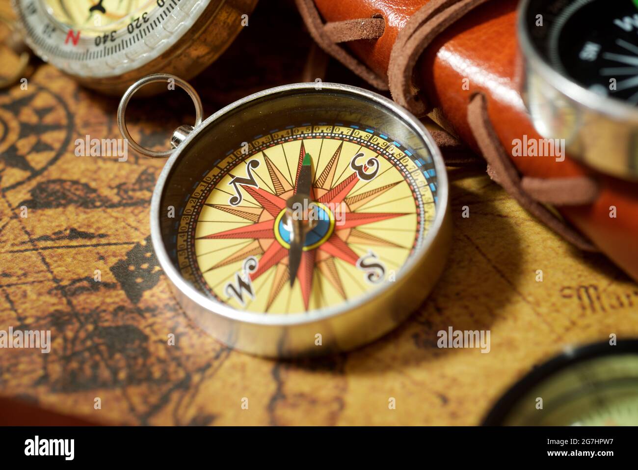 Vintage compass and old navigation map Stock Photo - Alamy