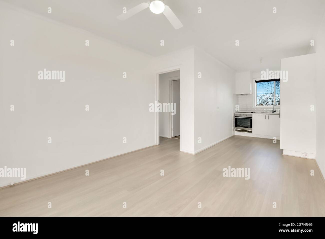 Empty living room with a small kitchen and bathroom. Empty apartment ...