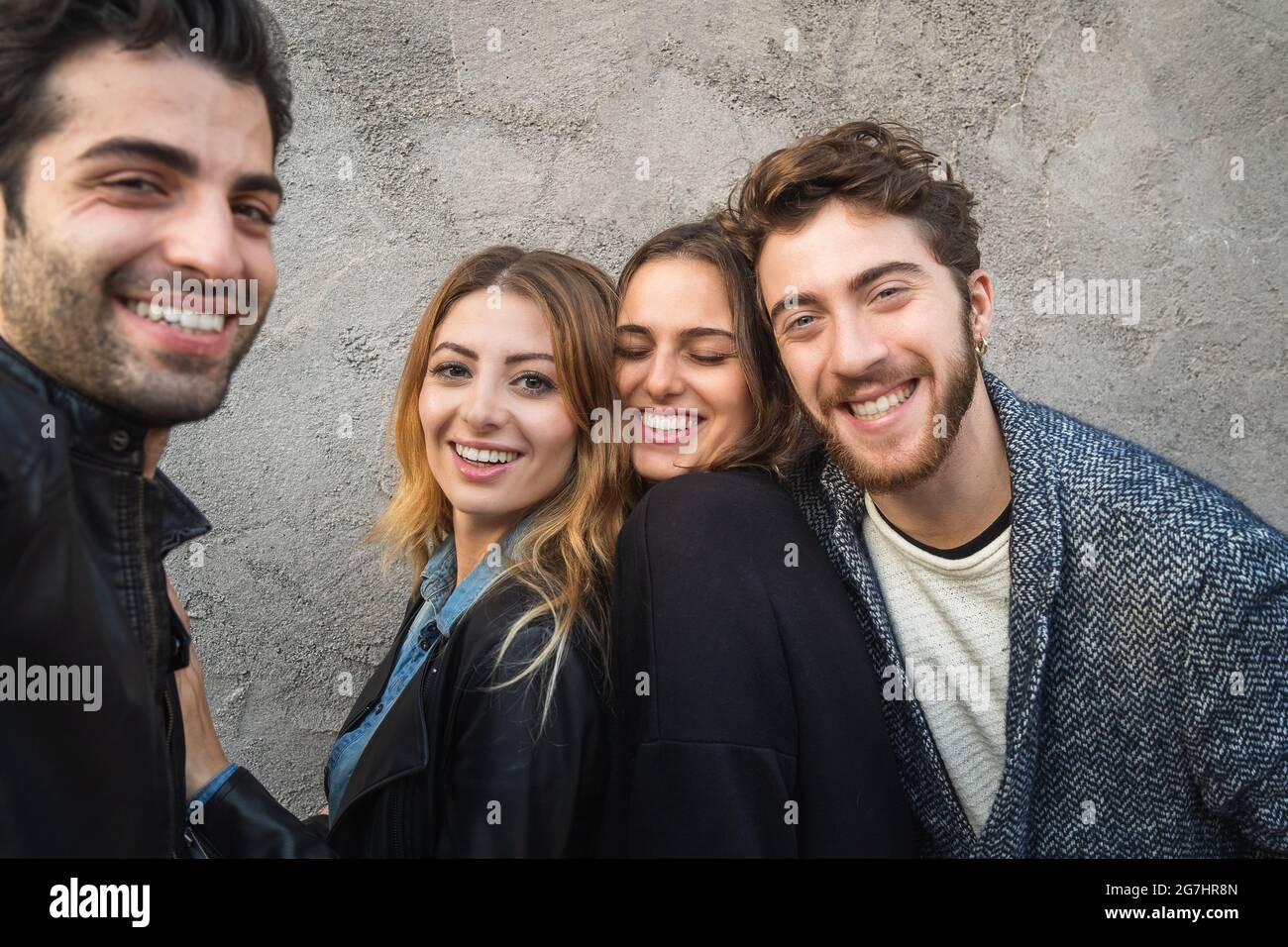 Portrait of millennials smiling at the camera. Group of young people ...