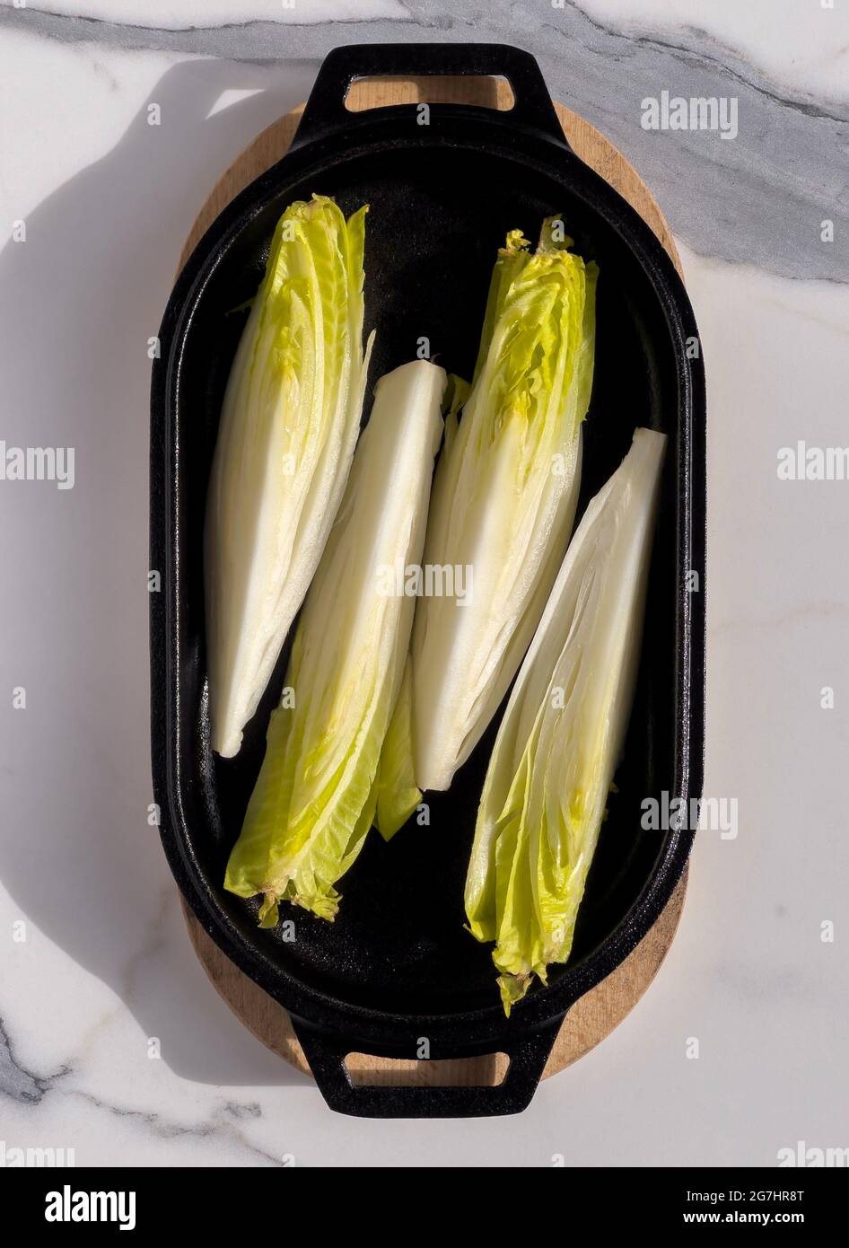 chicory in cast iron roasting dish Stock Photo - Alamy