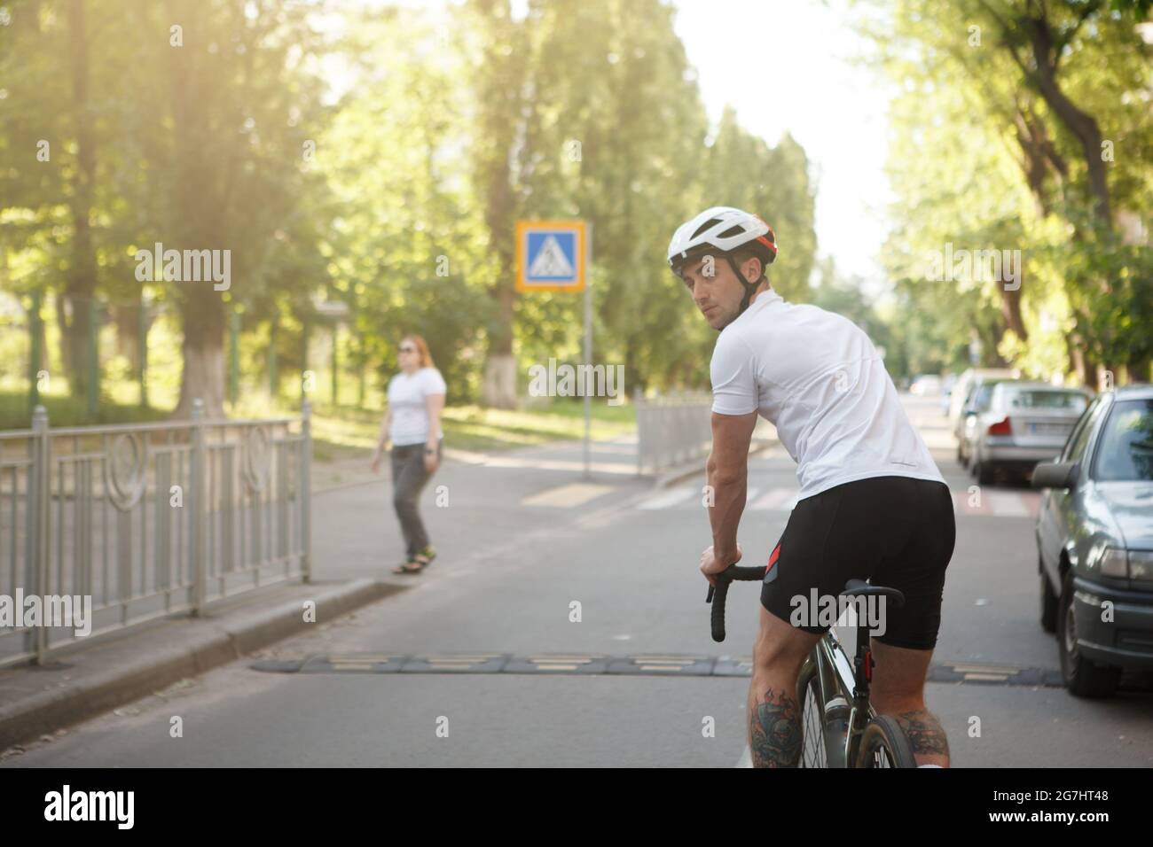 Male cyclist looking over shoulder hi-res stock photography and images ...