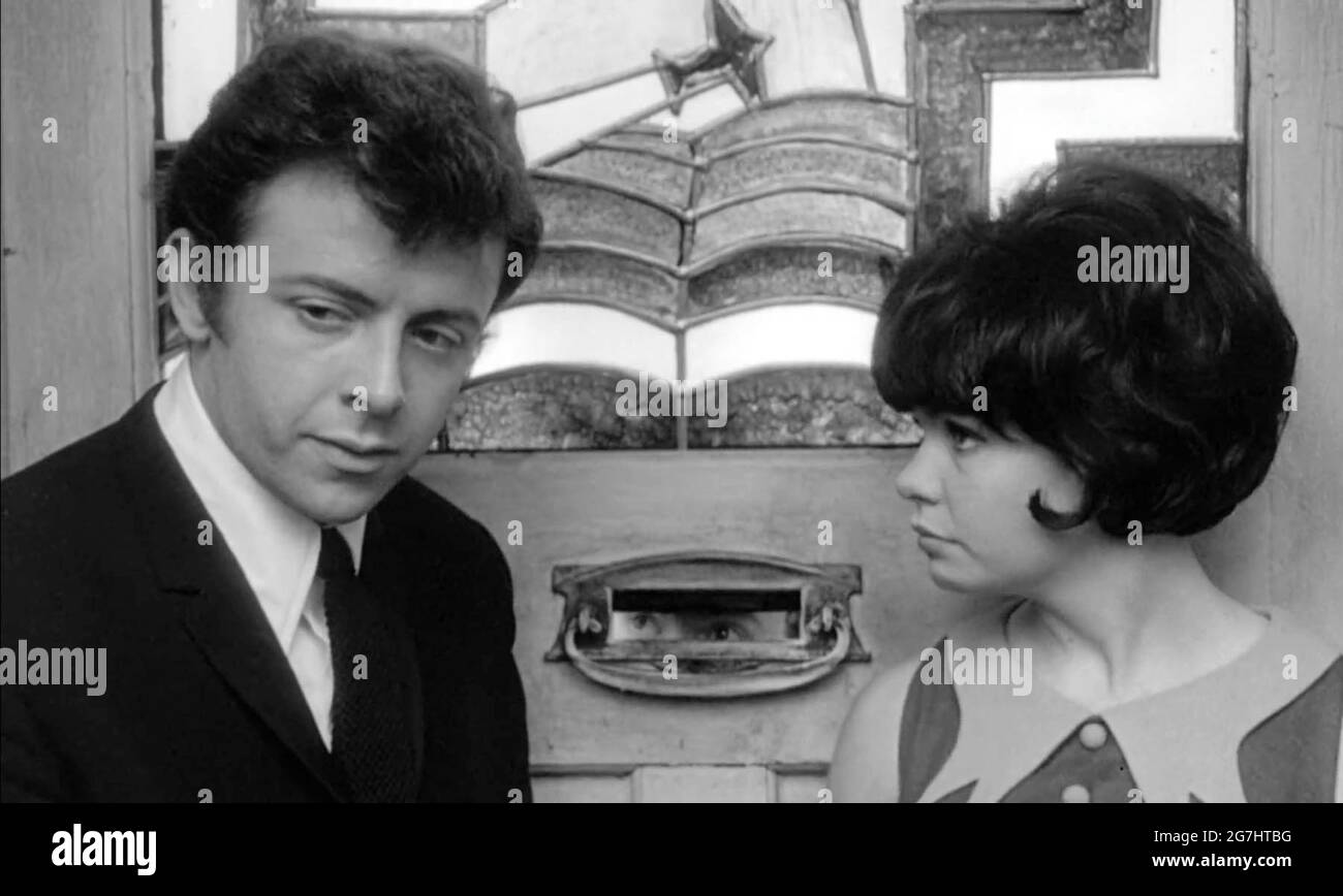 London.UK. Ray Brooks and Michael Crawford (eyes looking through the ...