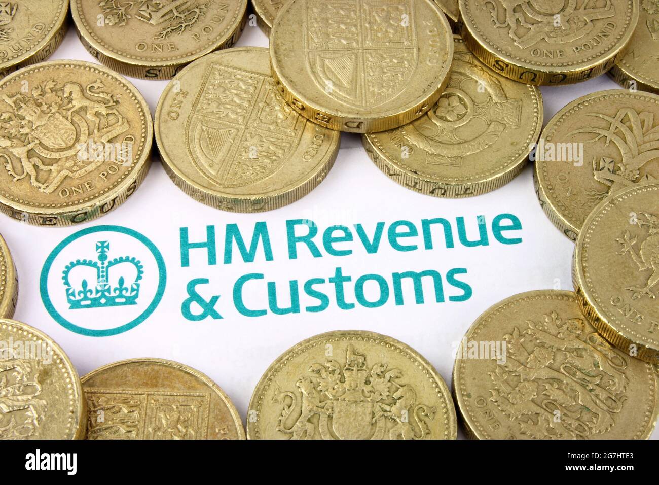 UK Revenue & Customs Tax Return surrounded by Pound coins Stock Photo ...