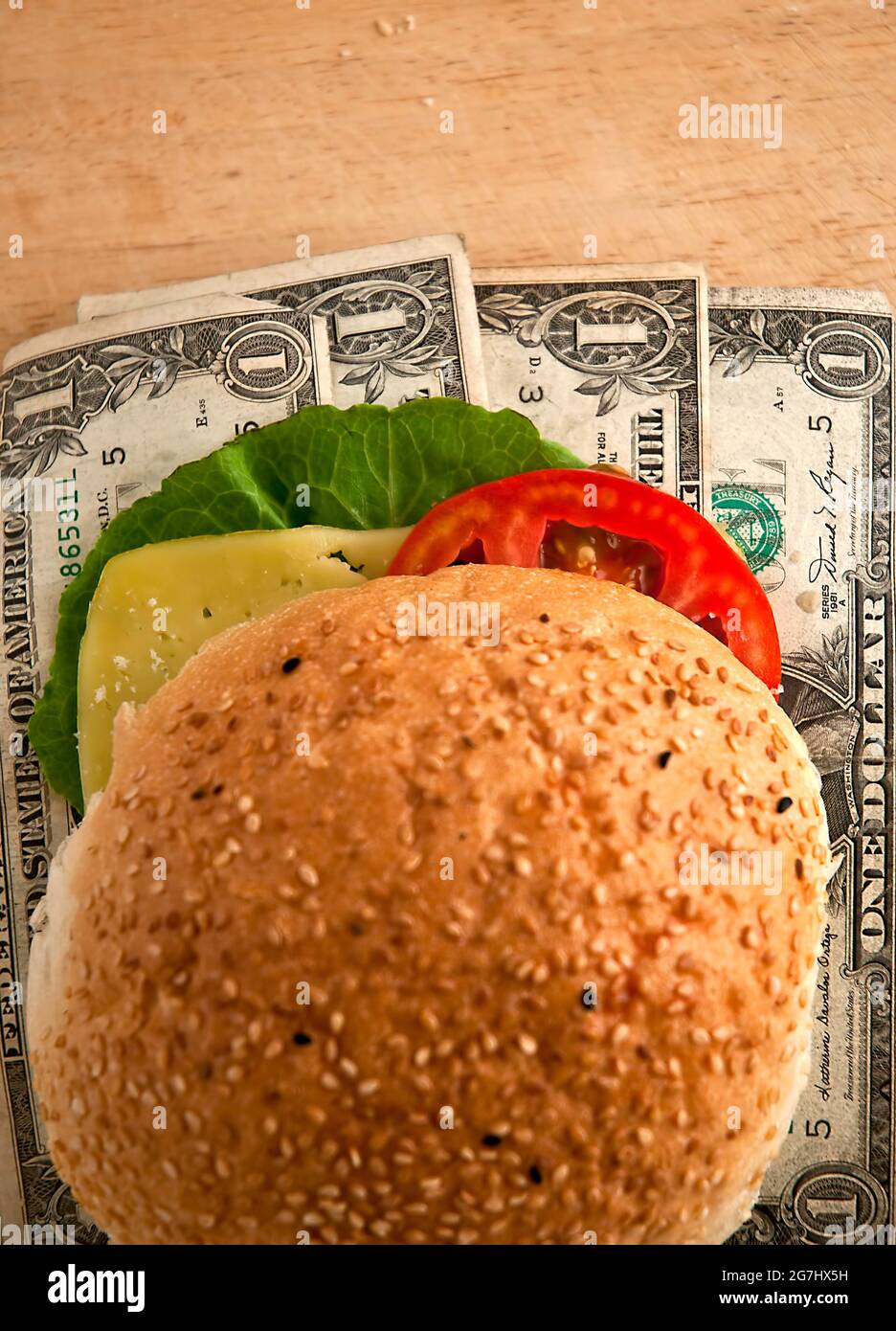 US dollars in a hamburger bun, close-up Stock Photo - Alamy