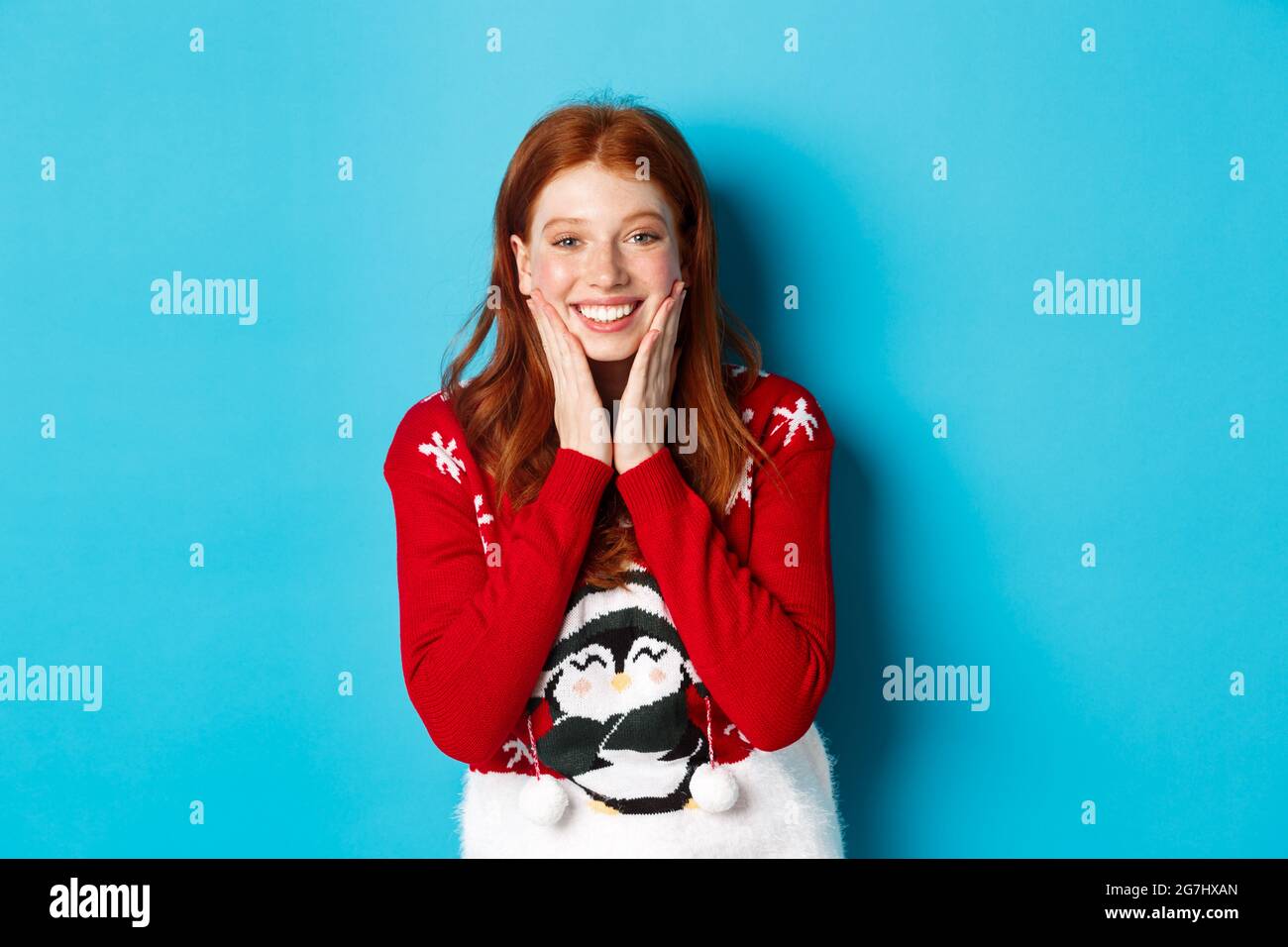 Winter holidays and Christmas Eve concept. Adorable redhead girl ...