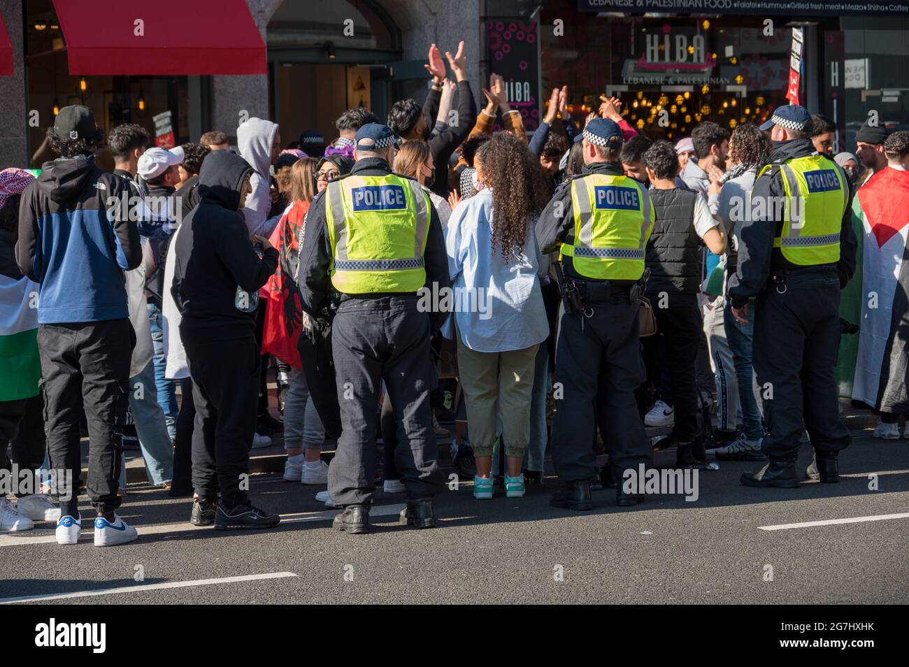Cop watching protest hi-res stock photography and images - Alamy