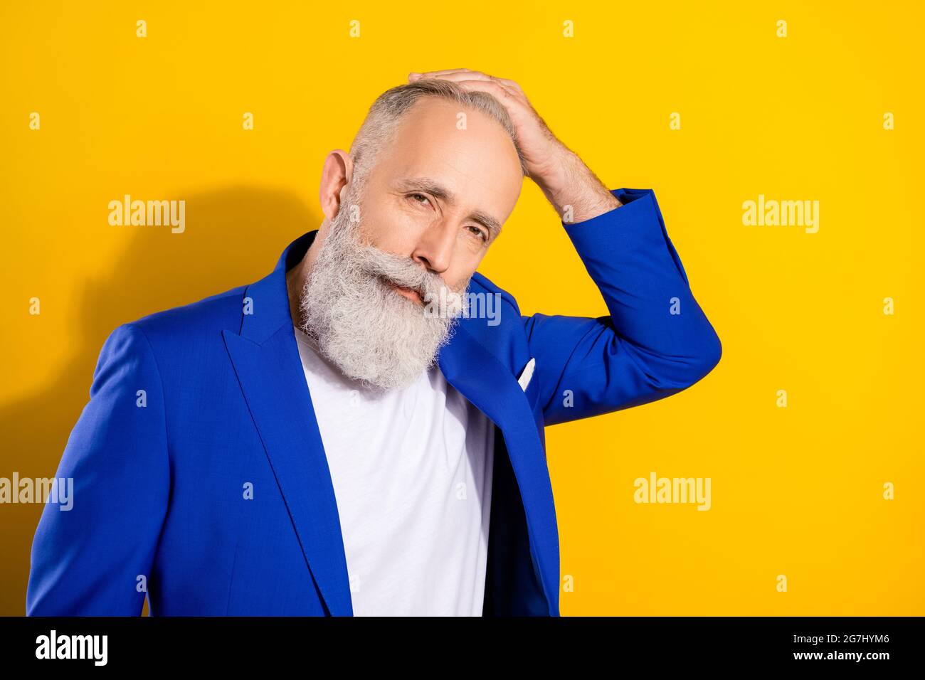 Photo portrait of senior serious business man touching hairstyle after ...