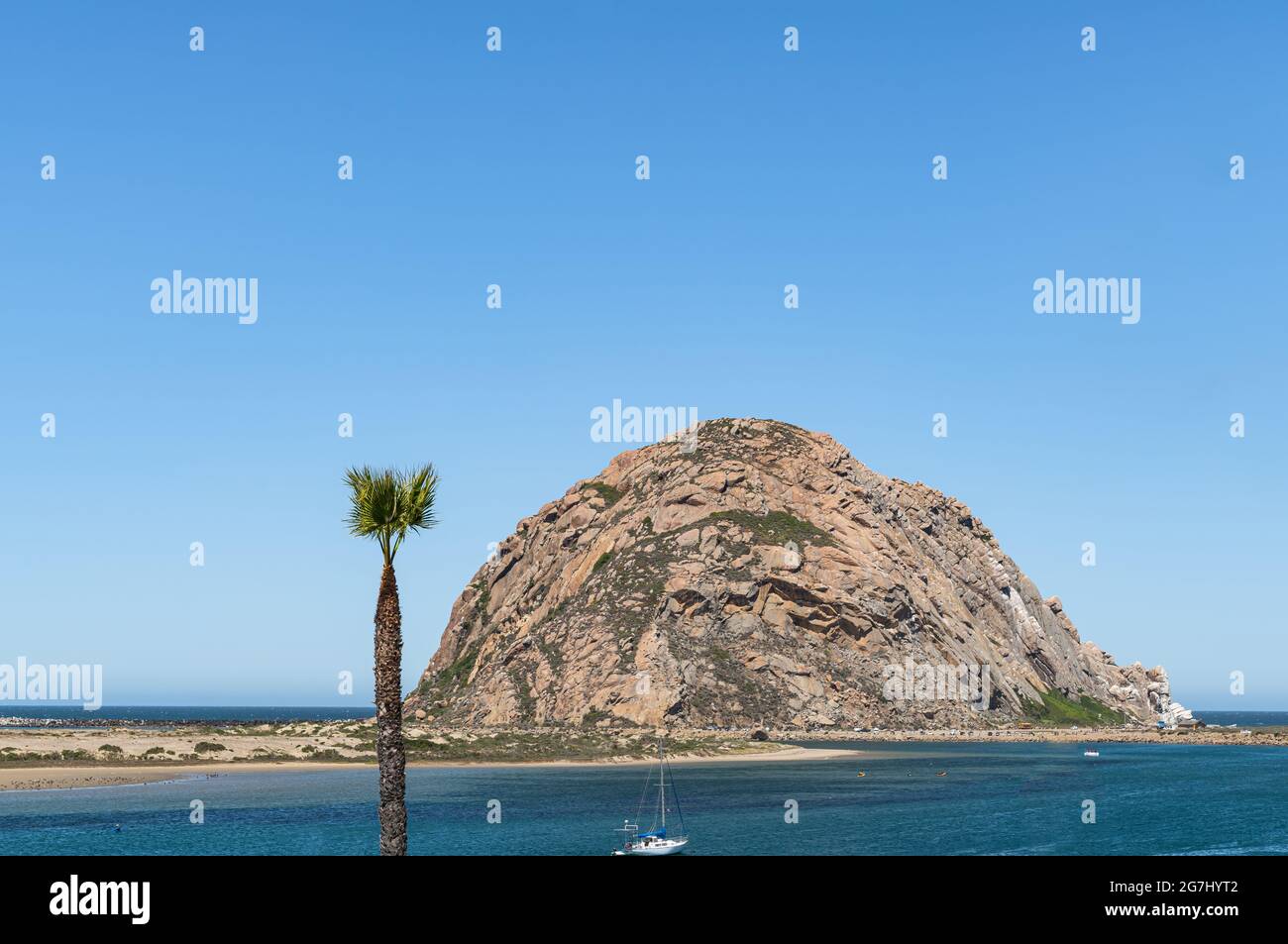 Morro Bay, CA, USA - June 10 2021: Brown Morro Rock in deep blue ...