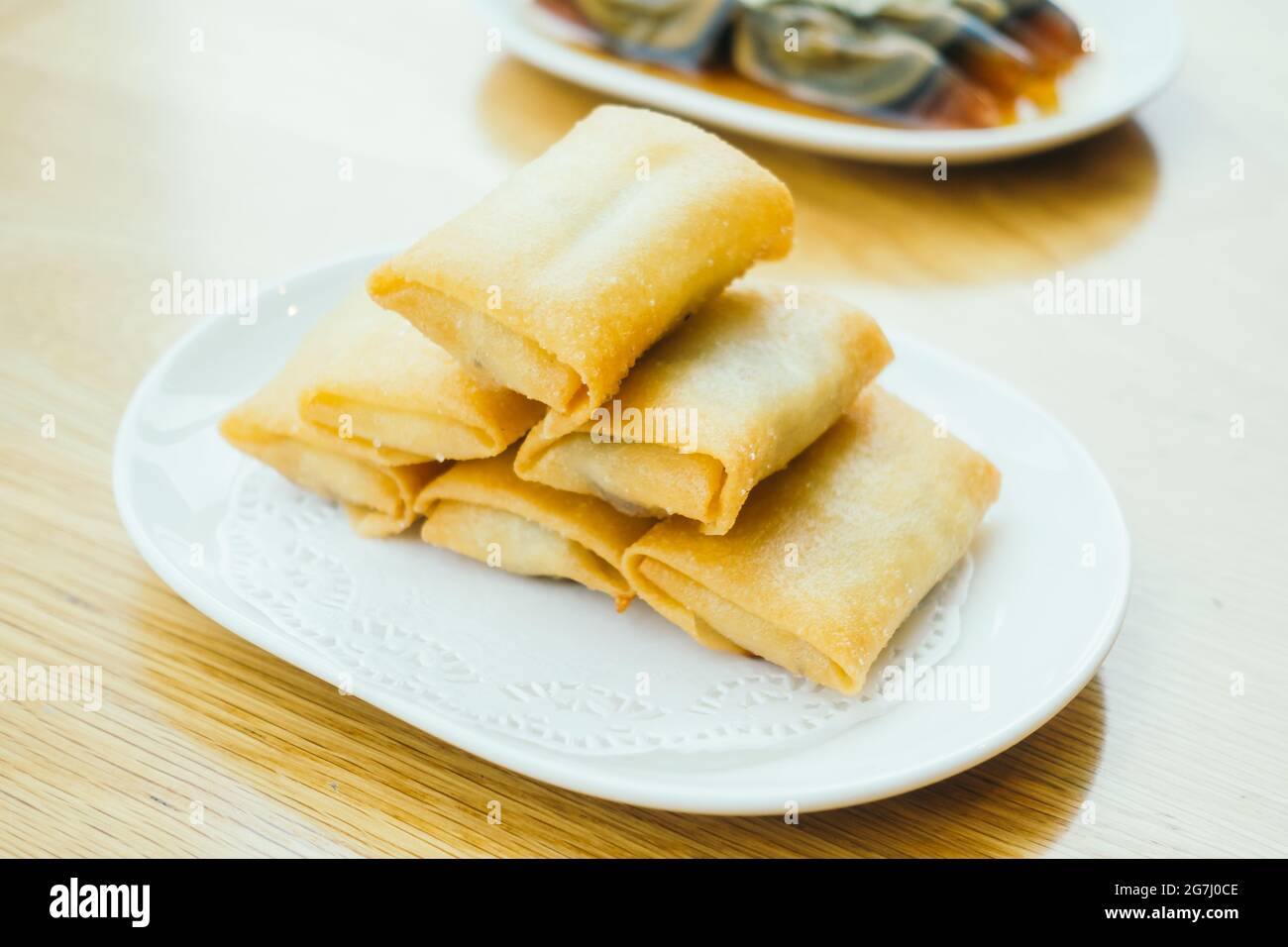 Fried spring roll in white plate - Chinese food style Stock Photo - Alamy