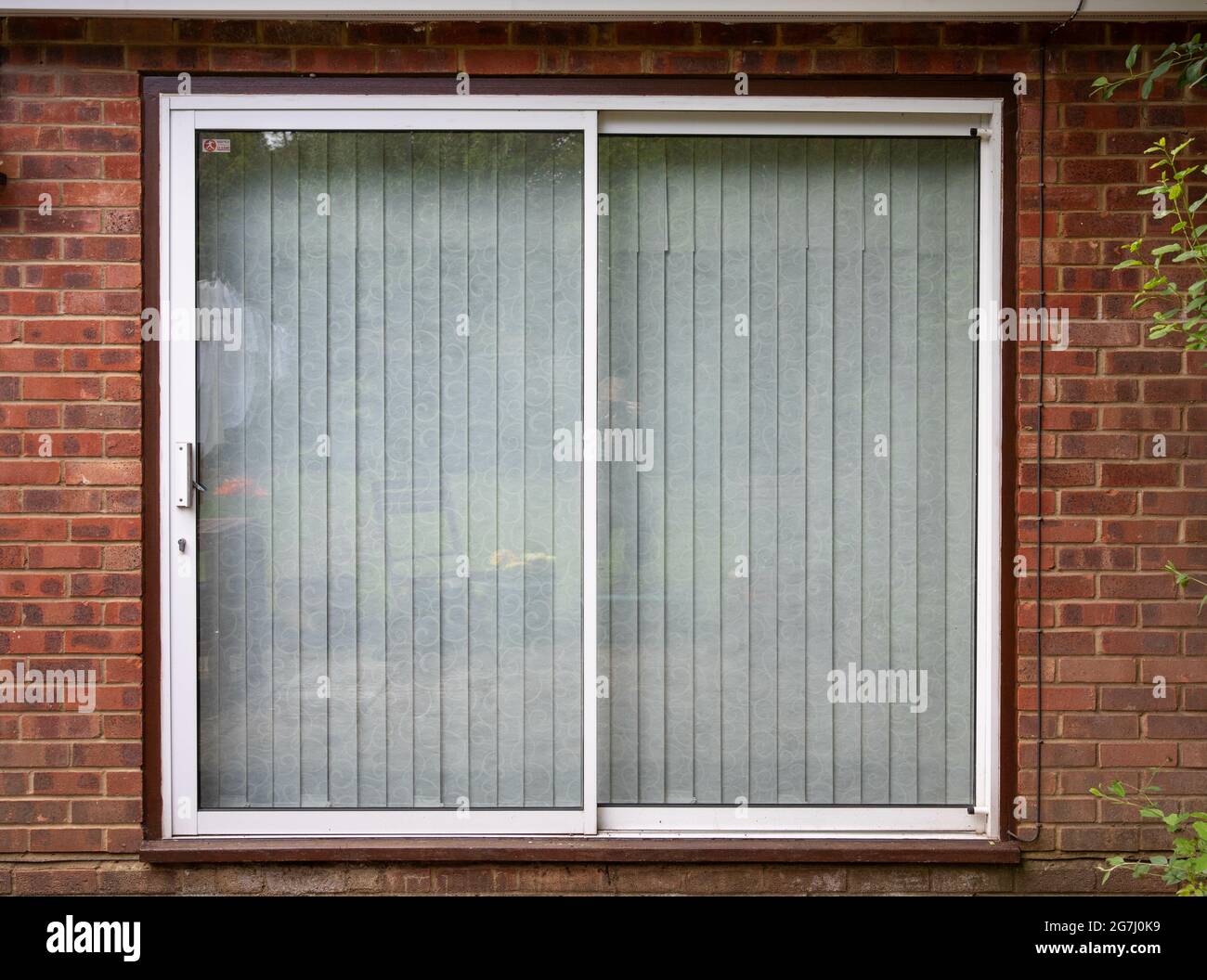 Closeup shot of a closed window on a brick wall background Stock Photo ...