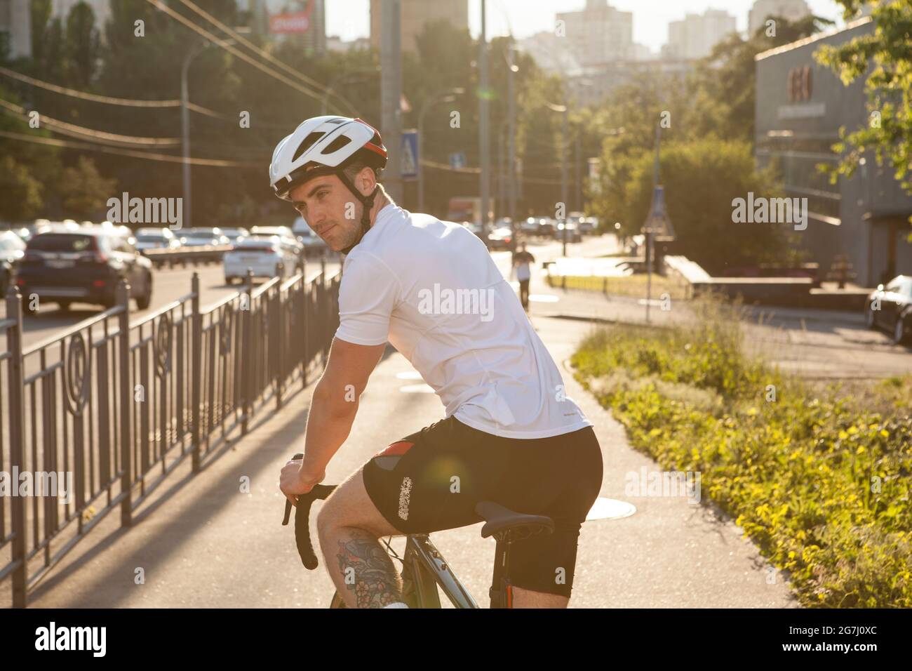 Male cyclist looking over shoulder hi-res stock photography and images ...