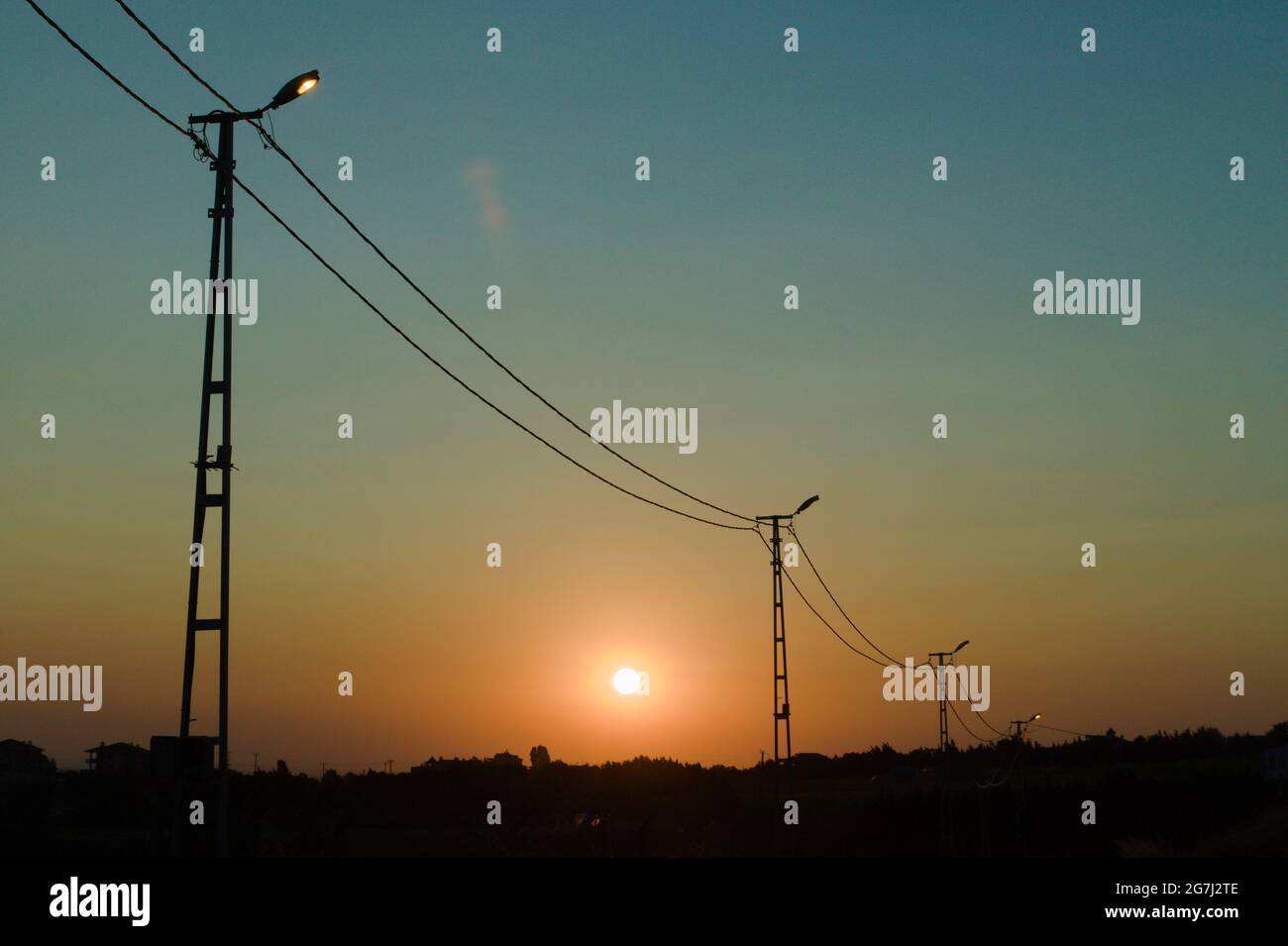 Electrical poles sunset hi-res stock photography and images - Alamy