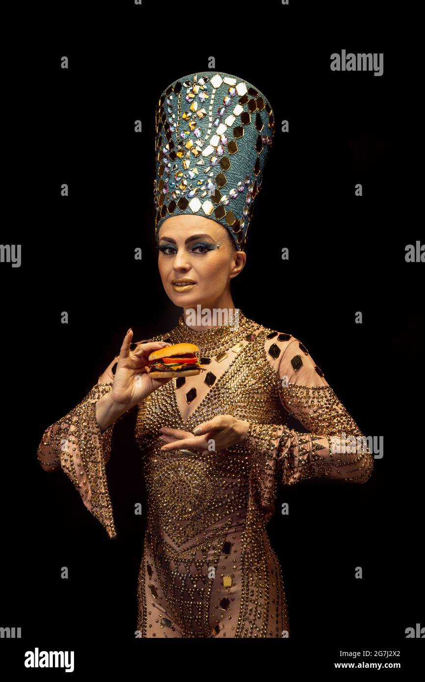 Portrait of young woman in image of Nefertiti in art performance ...